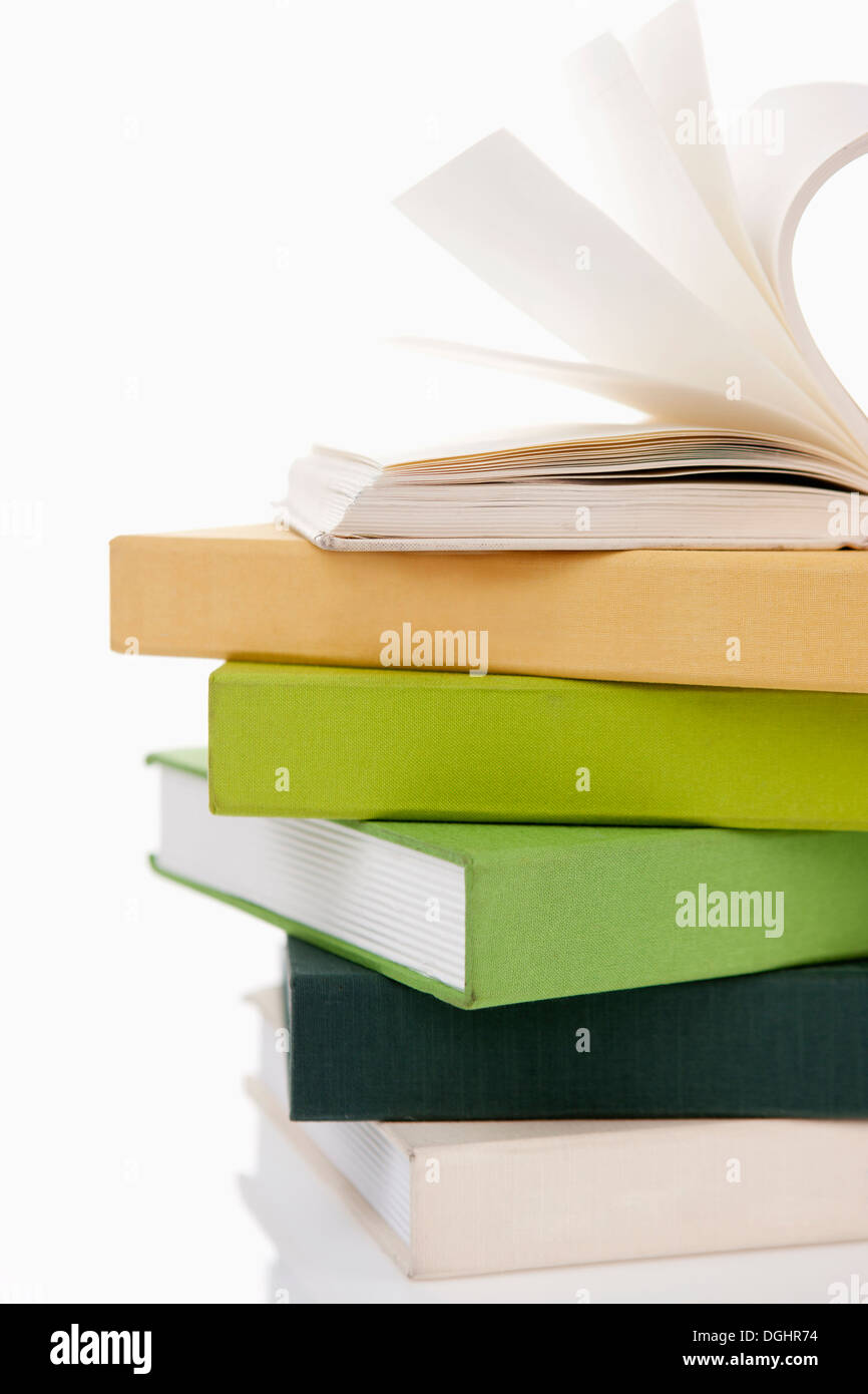 several different color books in a pile Stock Photo - Alamy