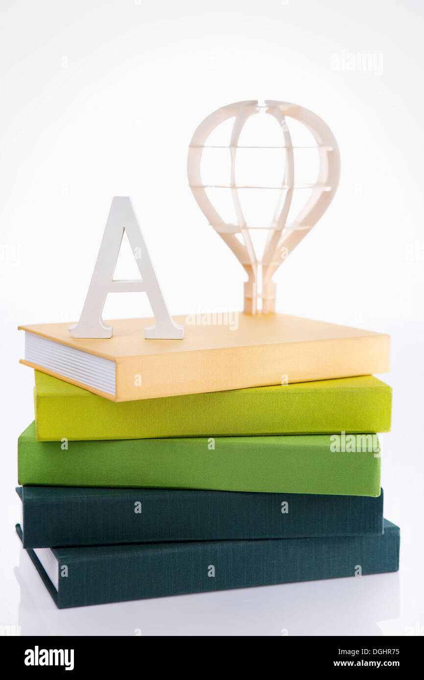 several different color books in a pile Stock Photo - Alamy