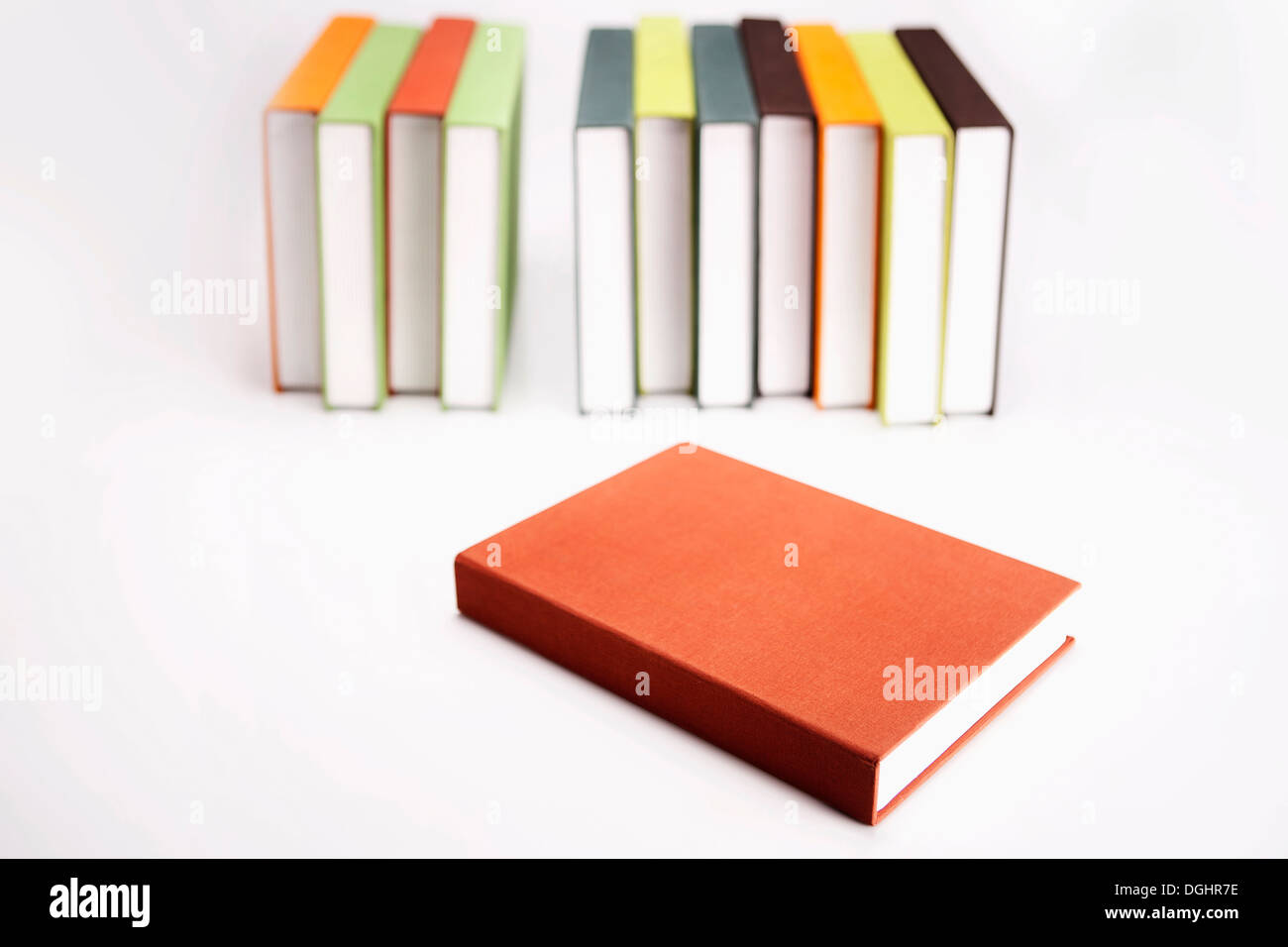 several different color books in a row Stock Photo - Alamy
