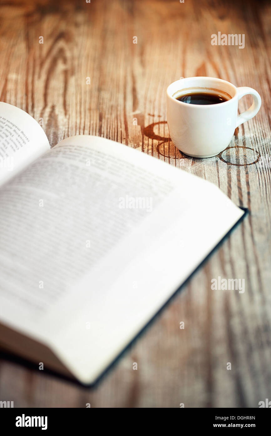 Coffee cup next to her hi-res stock photography and images - Alamy