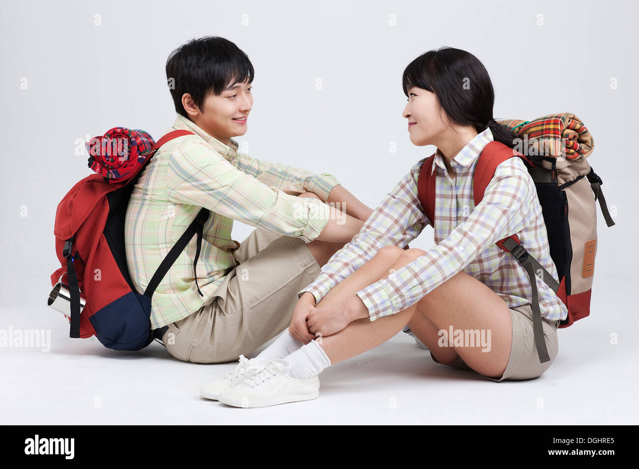 Sitting on ground couple hi-res stock photography and images - Alamy