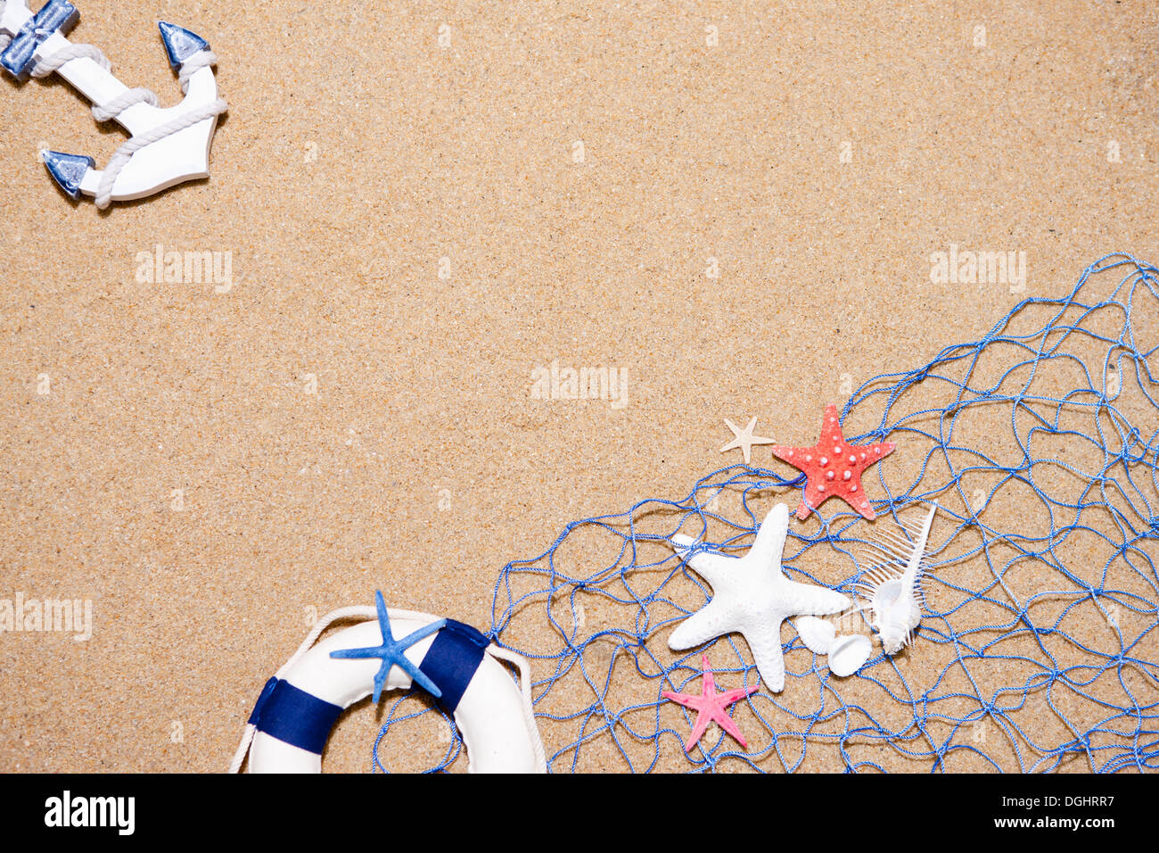 an anchor and a net on a beach Stock Photo - Alamy