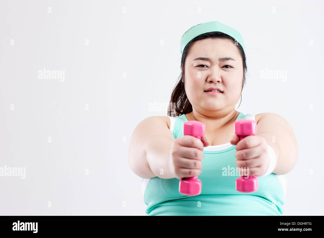 a fat girl working out in a gym outfit Stock Photo - Alamy