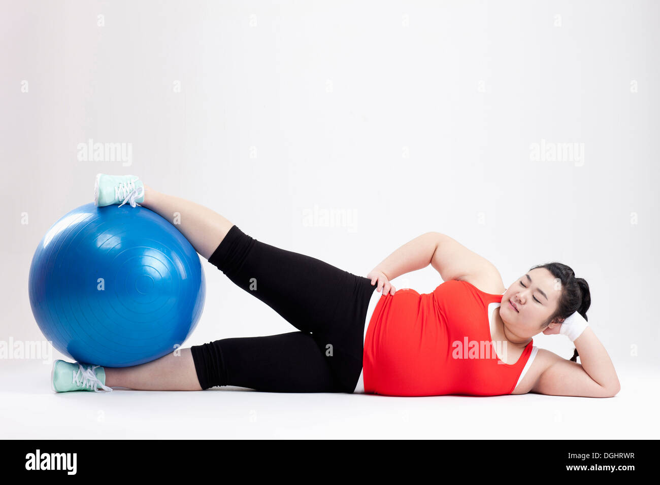 a fat girl working out in a gym outfit Stock Photo - Alamy