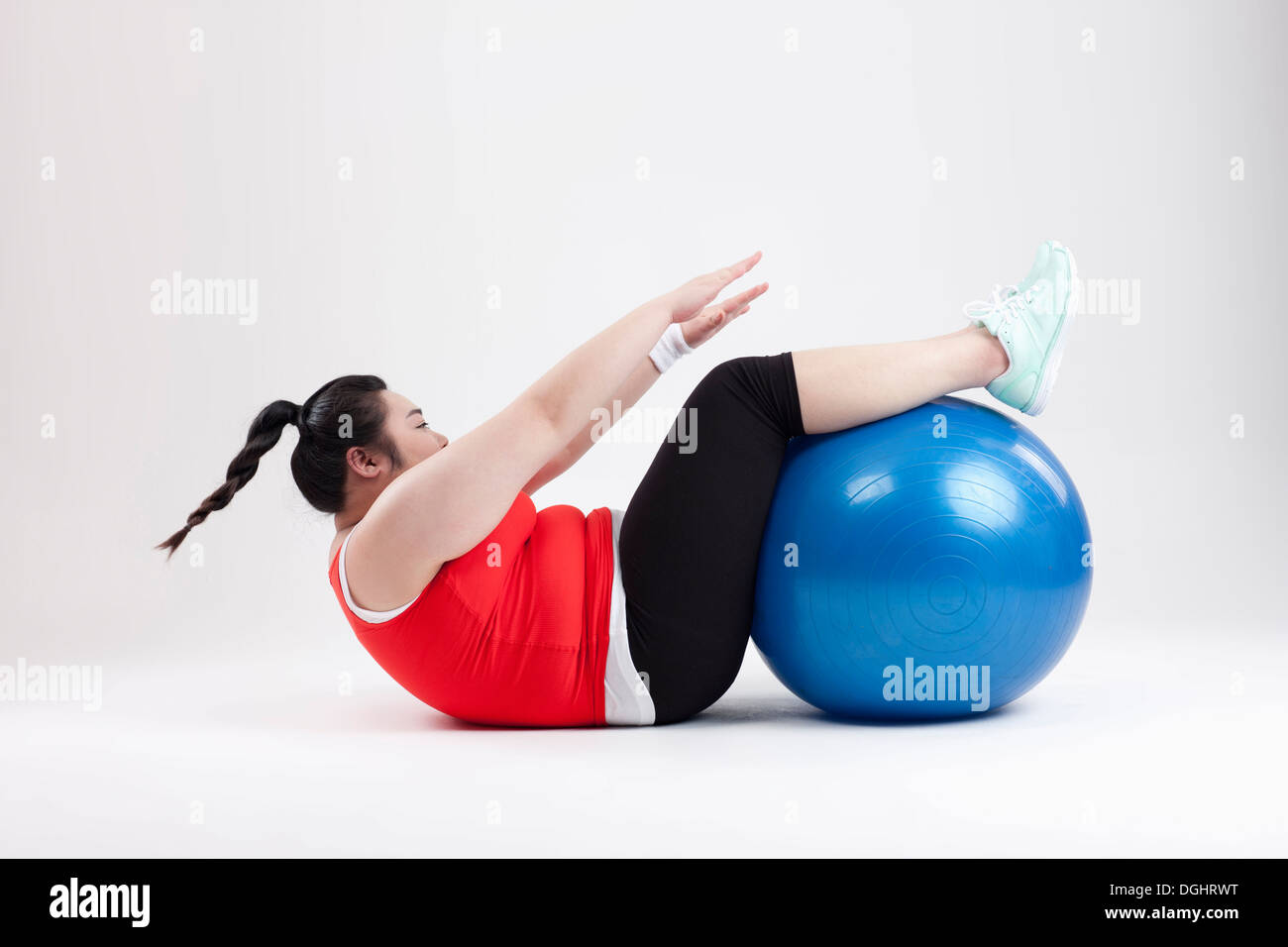 a fat girl working out in a gym outfit Stock Photo - Alamy