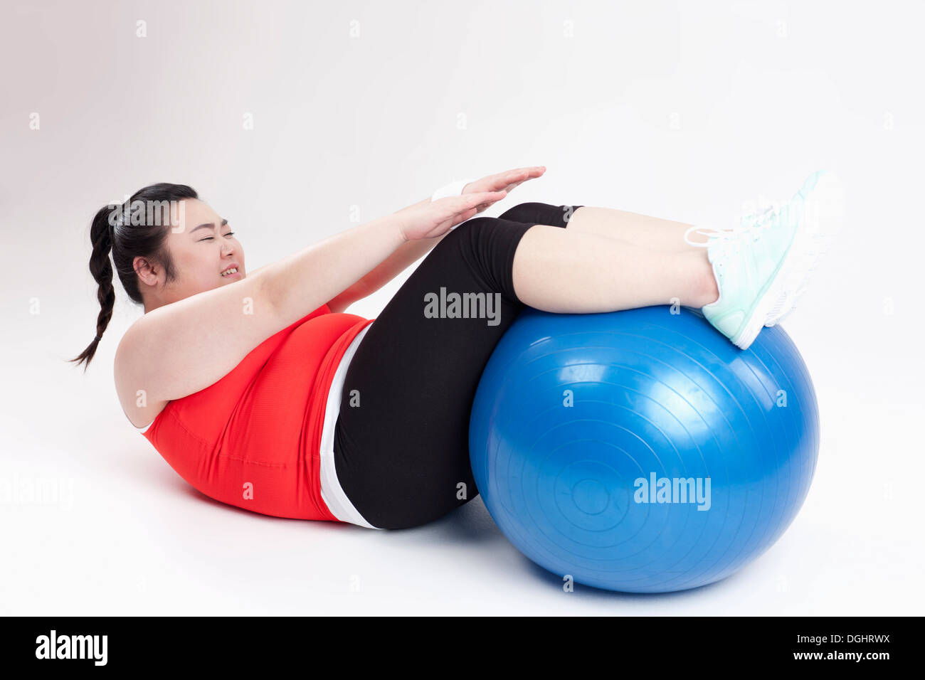 a fat girl working out in a gym outfit Stock Photo - Alamy