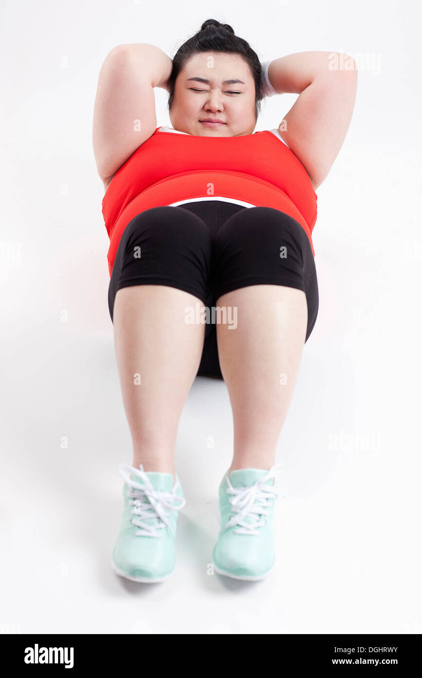 a fat girl working out in a gym outfit Stock Photo - Alamy
