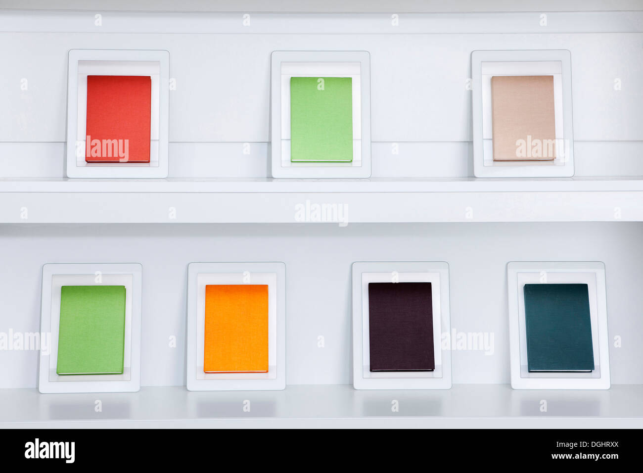different color tablets in rows on a shelf Stock Photo - Alamy