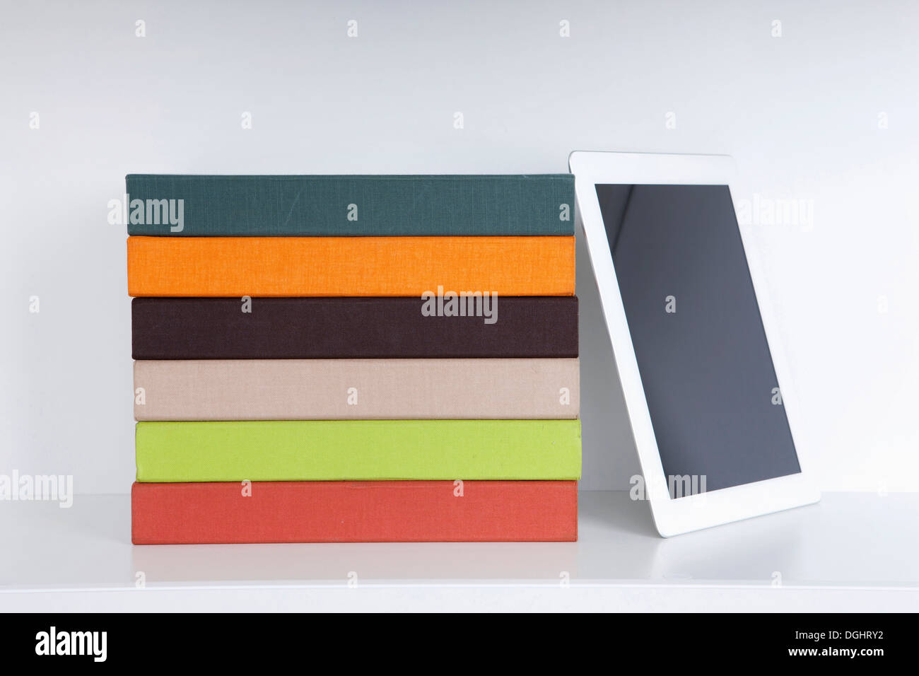 Tablet leaning on books hi-res stock photography and images - Alamy