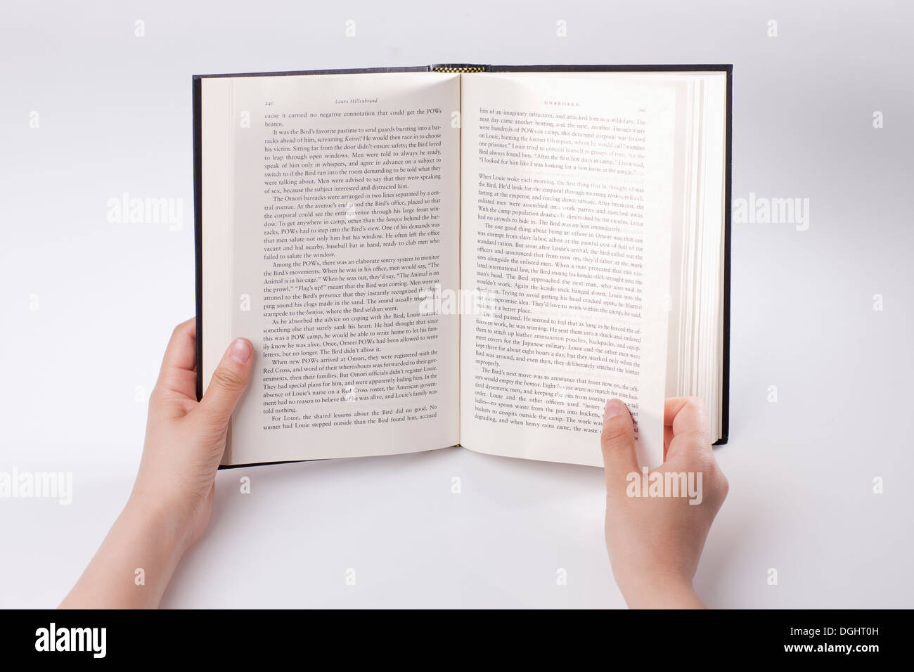 a pair of hands reading a book Stock Photo - Alamy