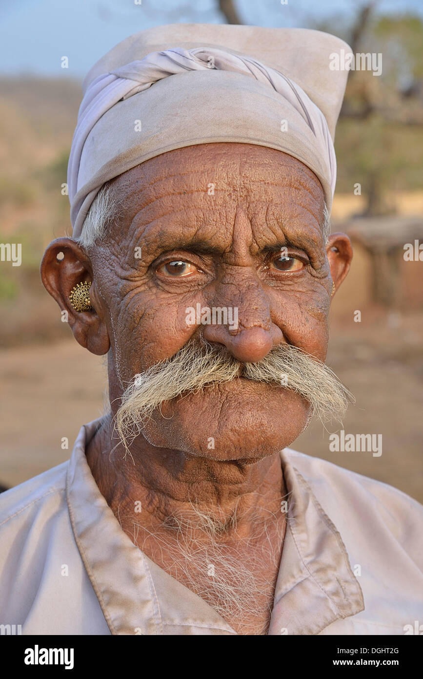 Herdsman from the tribe of the Maldhari in a typical white robe and ...