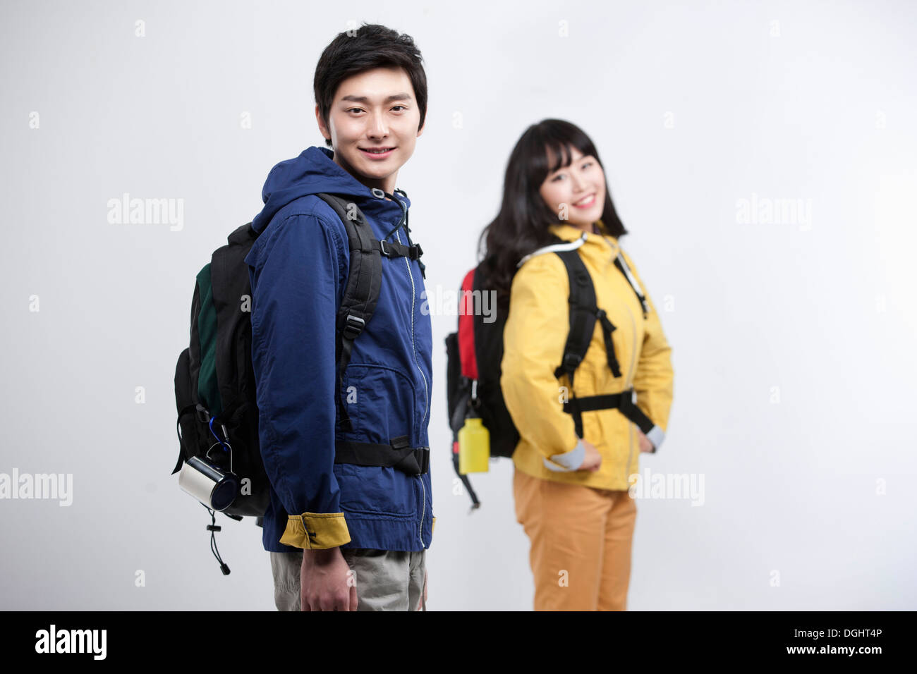 a couple wearing hiking gear Stock Photo - Alamy