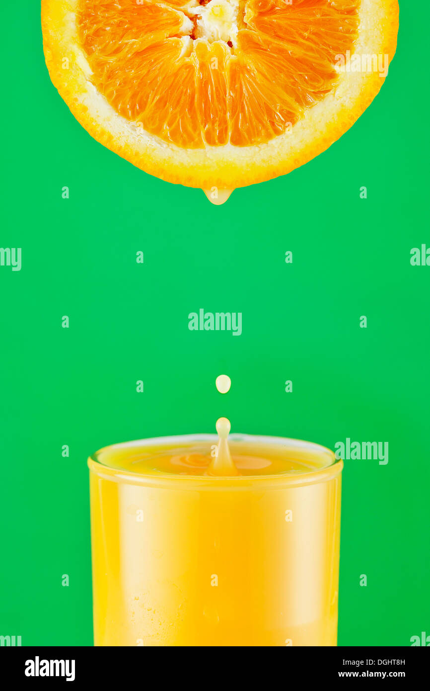 Orange half and glass of juice hi-res stock photography and images - Alamy