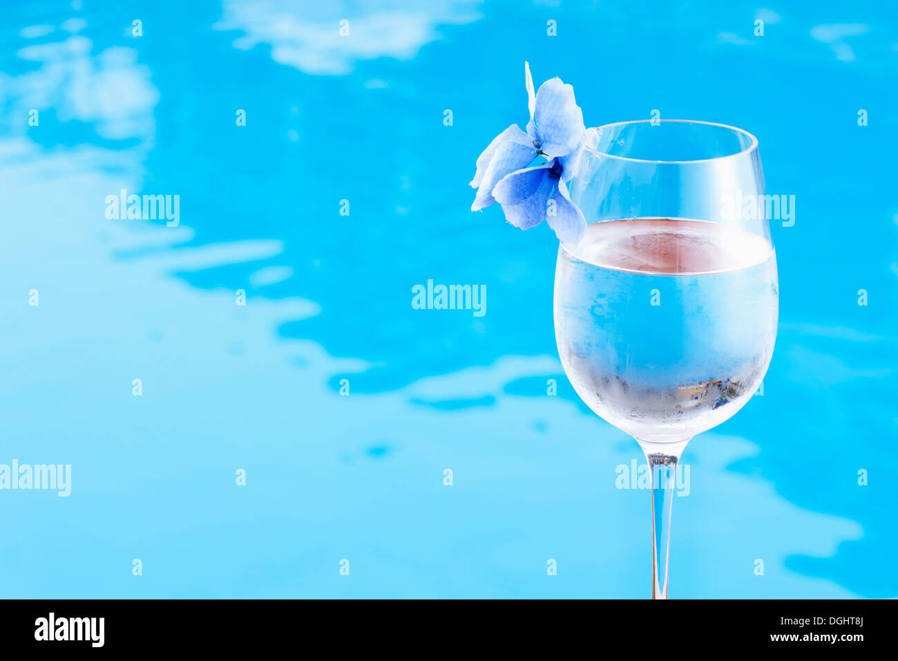 a glass of water next to a pool Stock Photo - Alamy