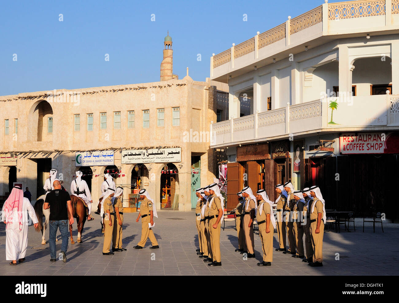 Police officers standing in front of the tower of the Islamic Cultural ...