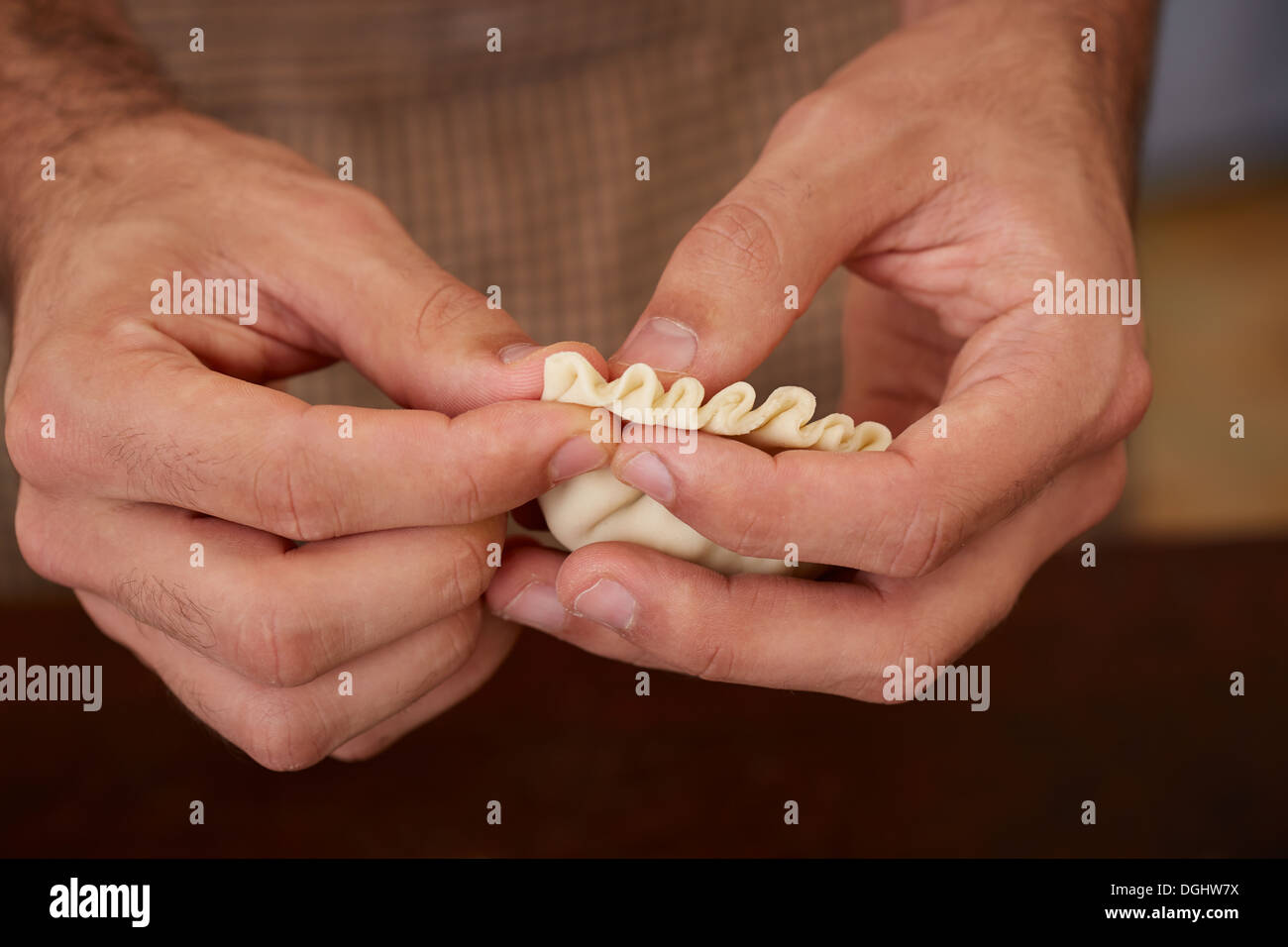 Hands preparing homemade dim-sum asian dumplings Stock Photo - Alamy