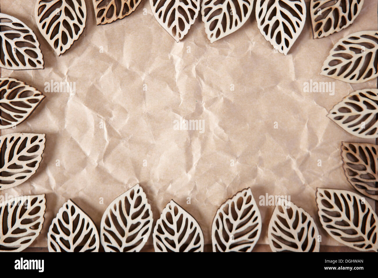 wooden leaf decorations on a paper sheet Stock Photo - Alamy