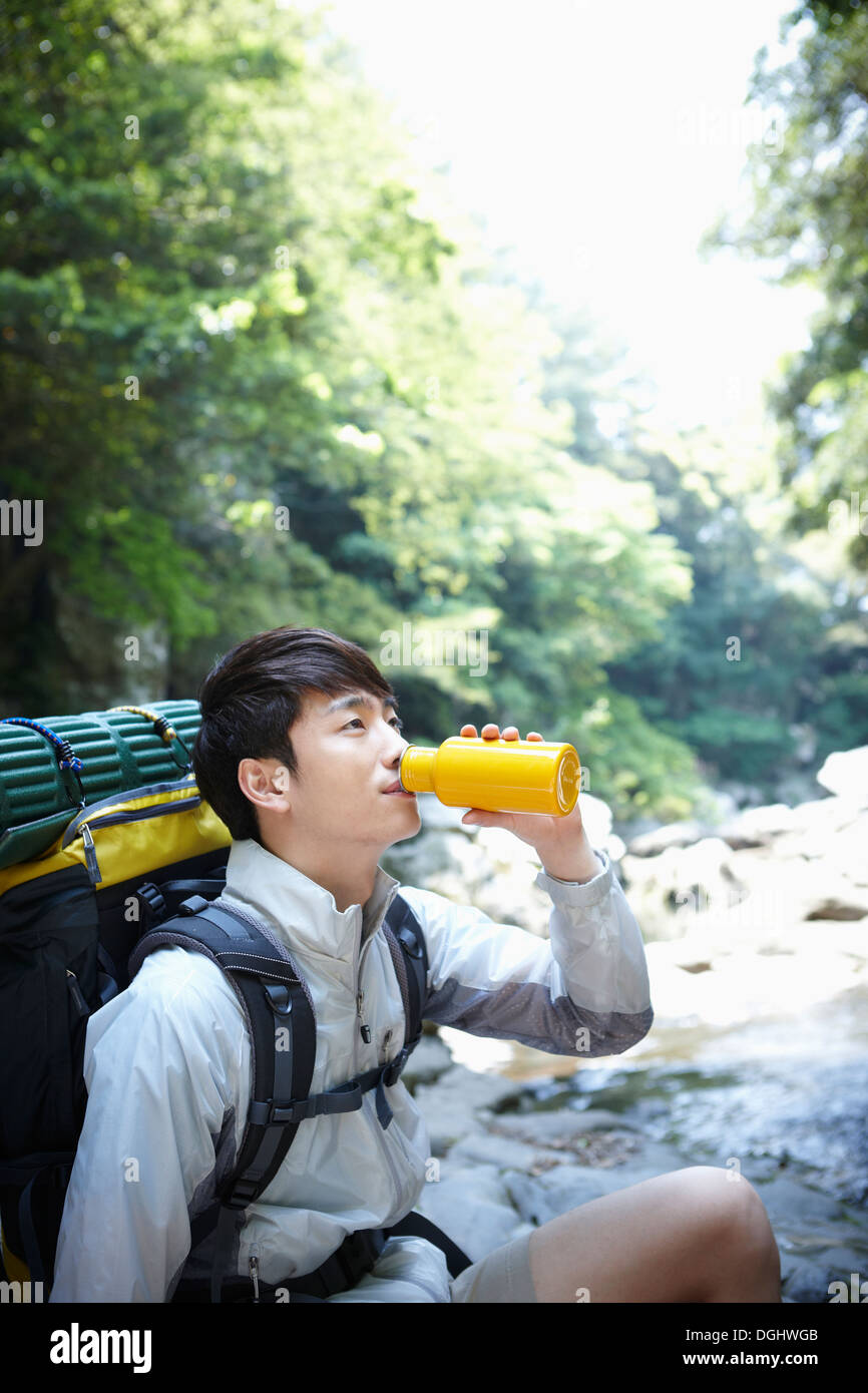 a man taking a rest in the woods Stock Photo - Alamy