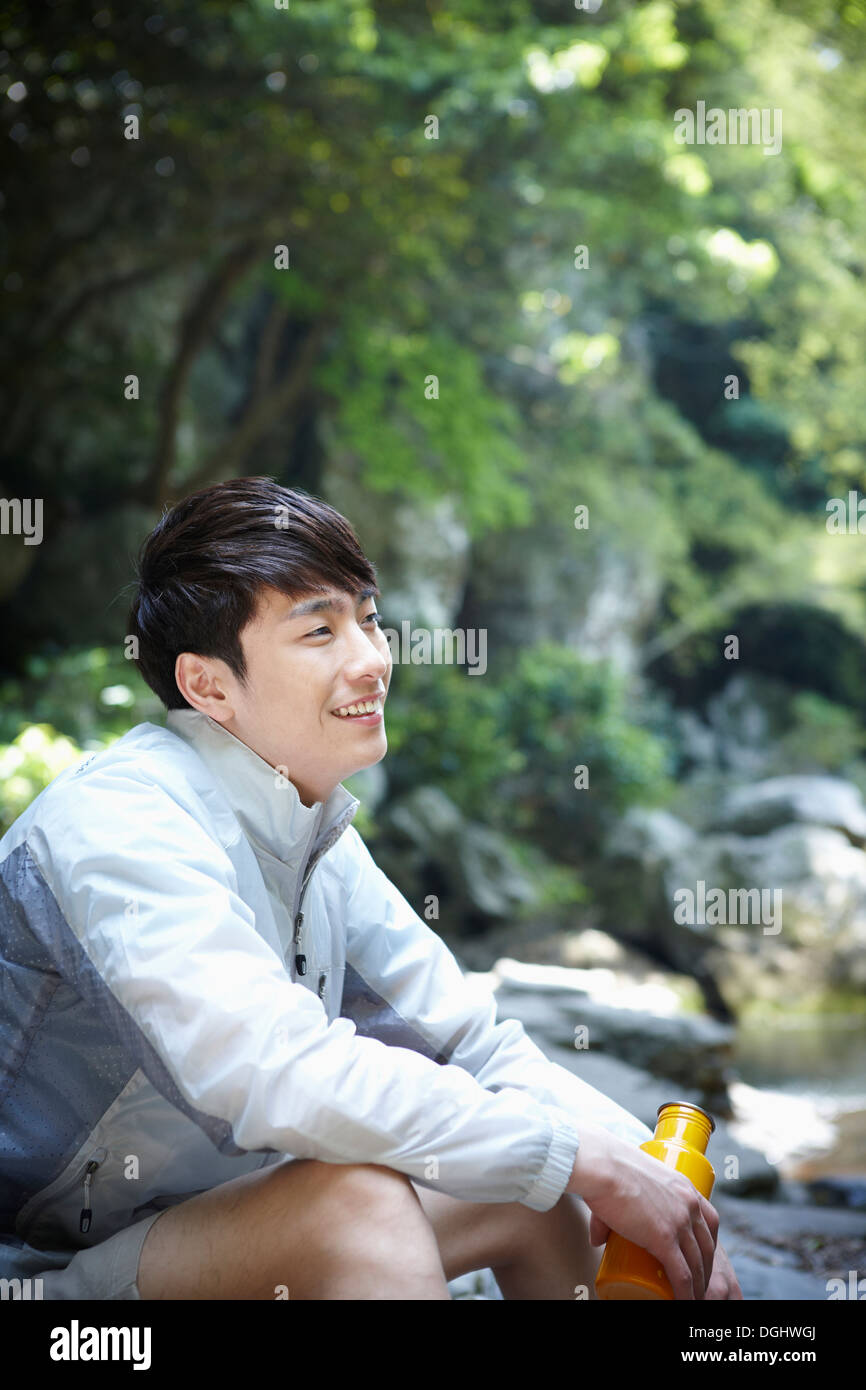 a man taking a rest in the woods Stock Photo - Alamy