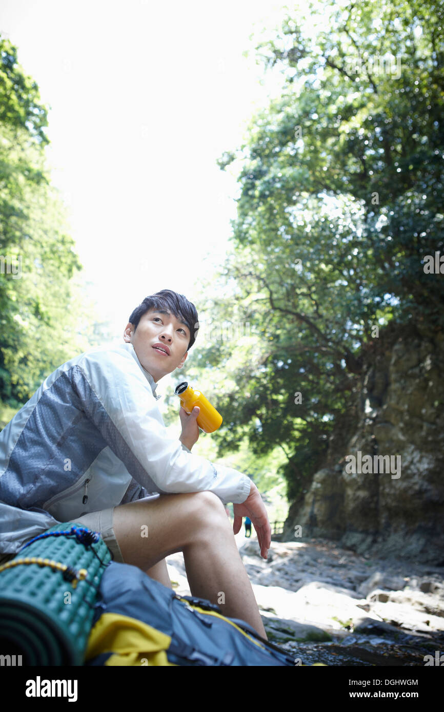 a man taking a rest in the woods Stock Photo - Alamy