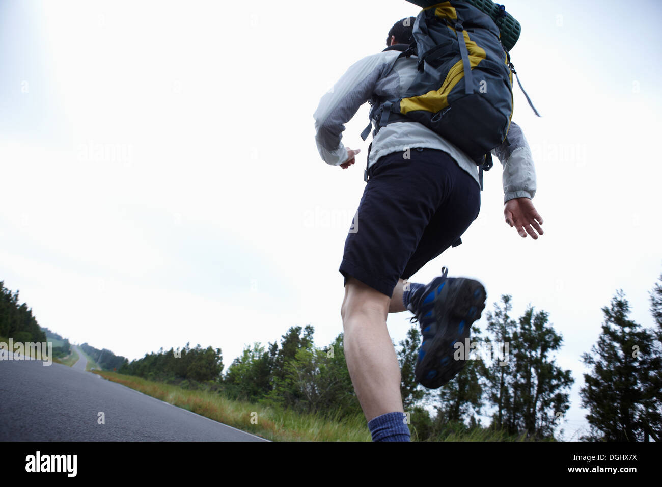 a hiker running on the road Stock Photo - Alamy