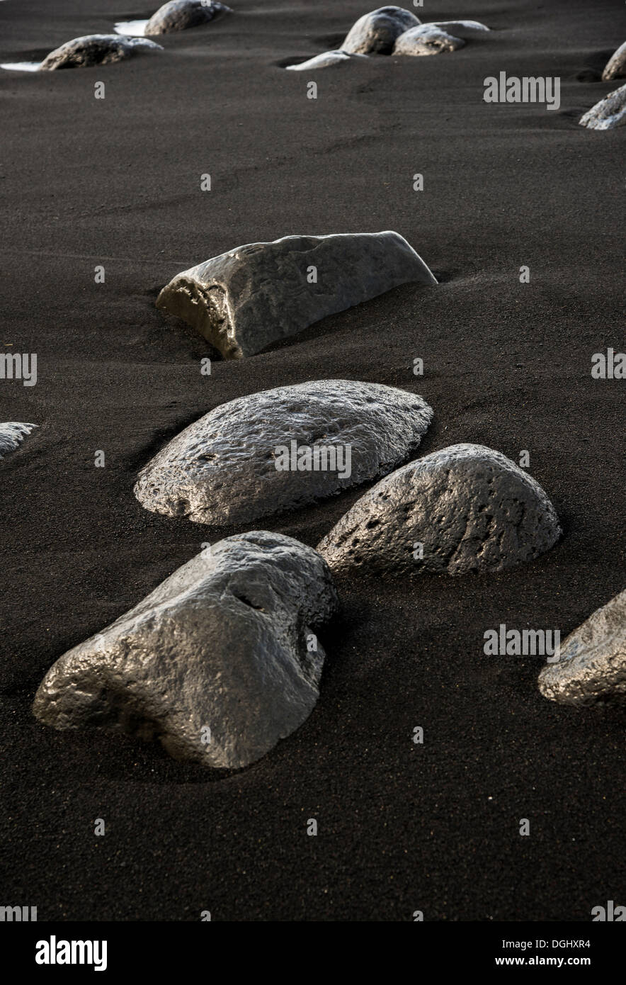 Sandy beach with basalt stones hi-res stock photography and images - Alamy