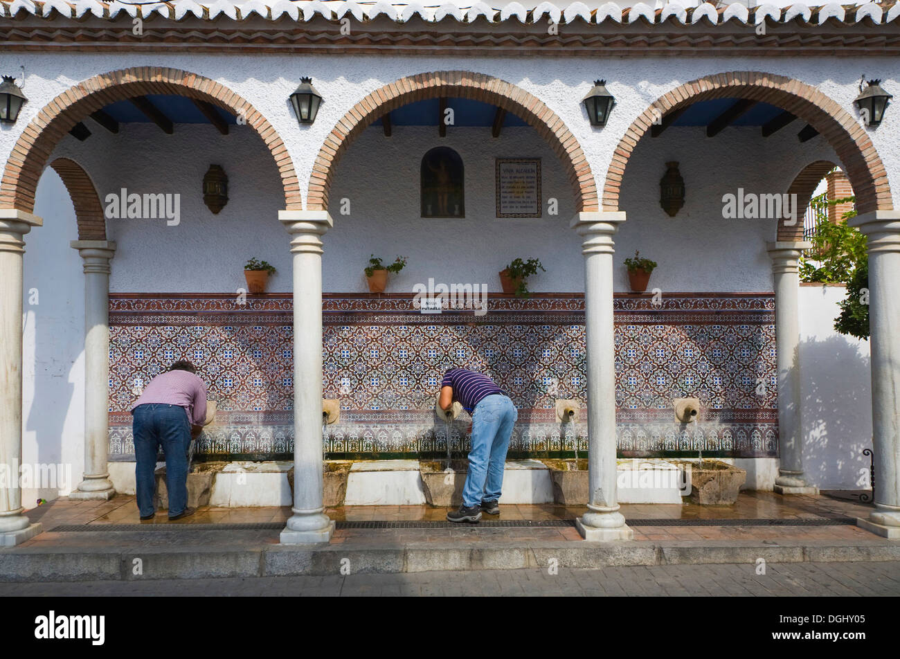 Moorish water fountain village of Alcaucin, Malaga province, Spain ...