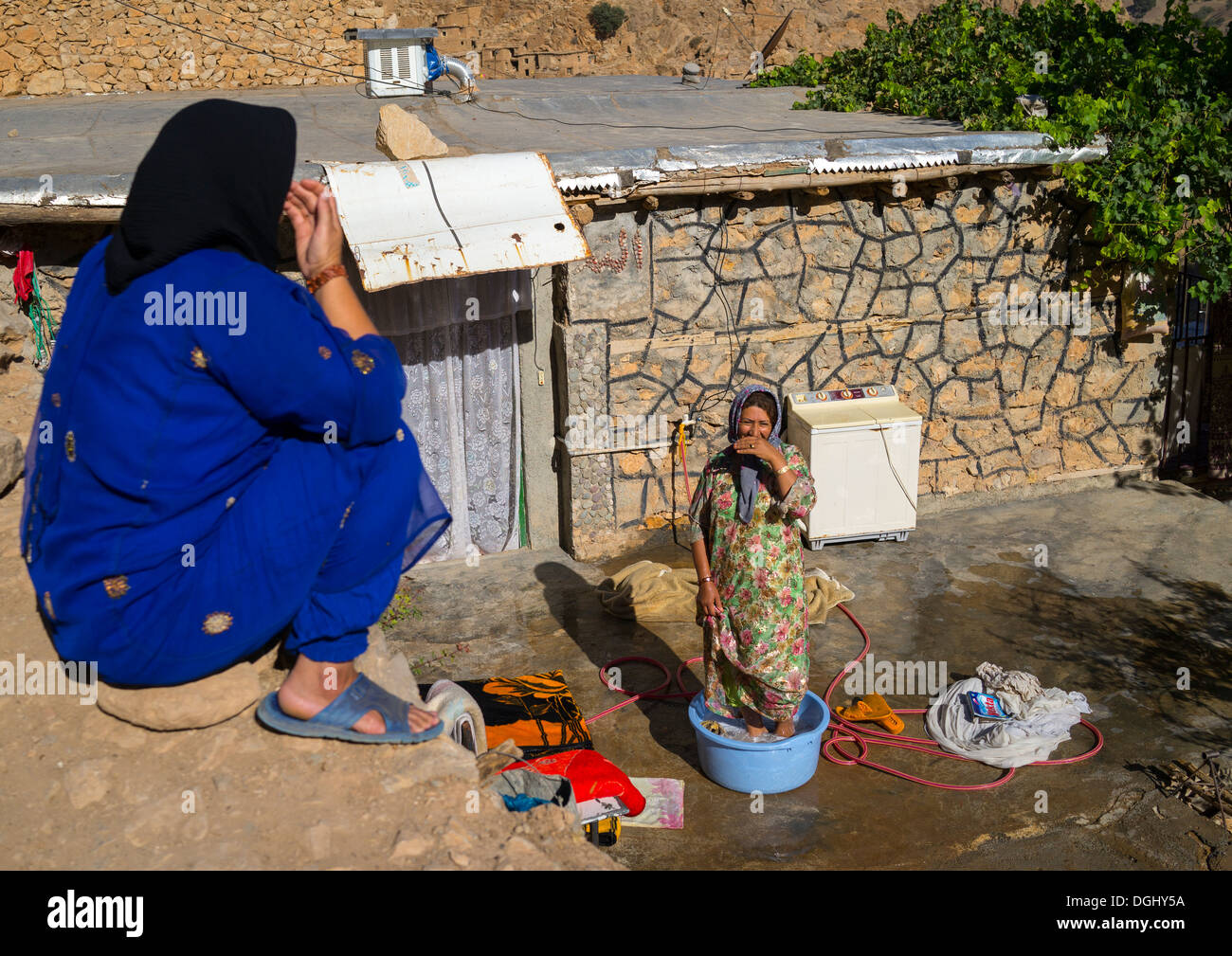 Women Washing Clothes In The Old Kurdish Village Of Palangan At Dusk, Iran Stock Photo - Alamy