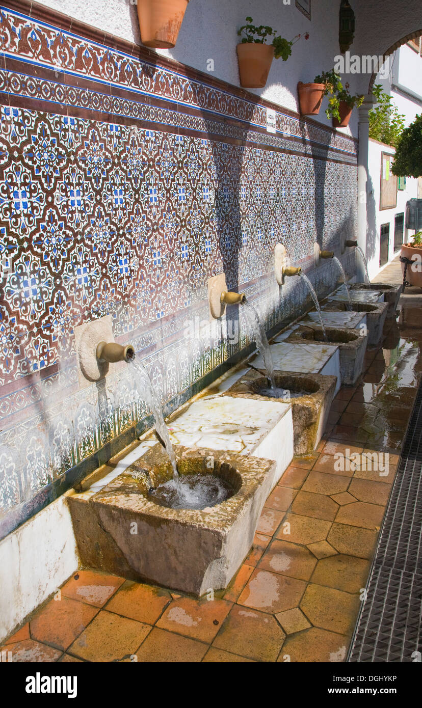 Moorish water fountain village of Alcaucin, Malaga province, Spain ...