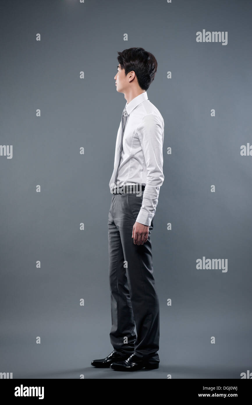 a business man standing Stock Photo - Alamy