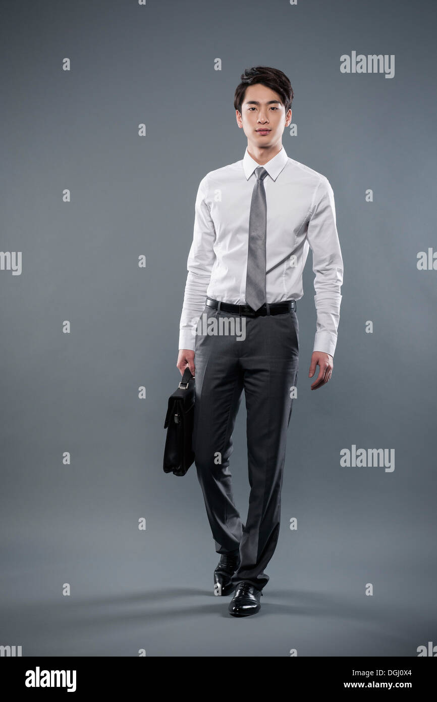 a business man standing Stock Photo - Alamy