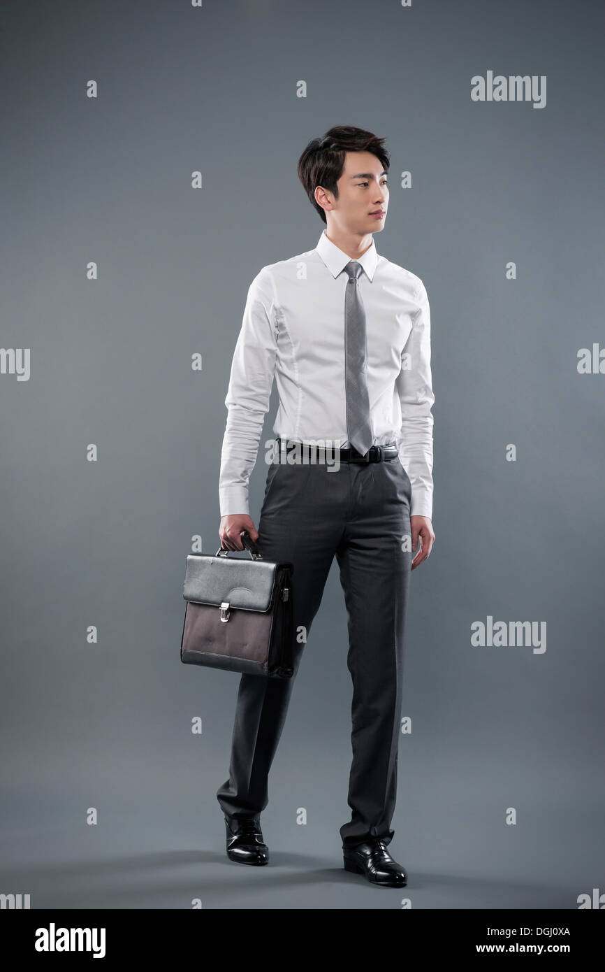 a business man standing Stock Photo - Alamy