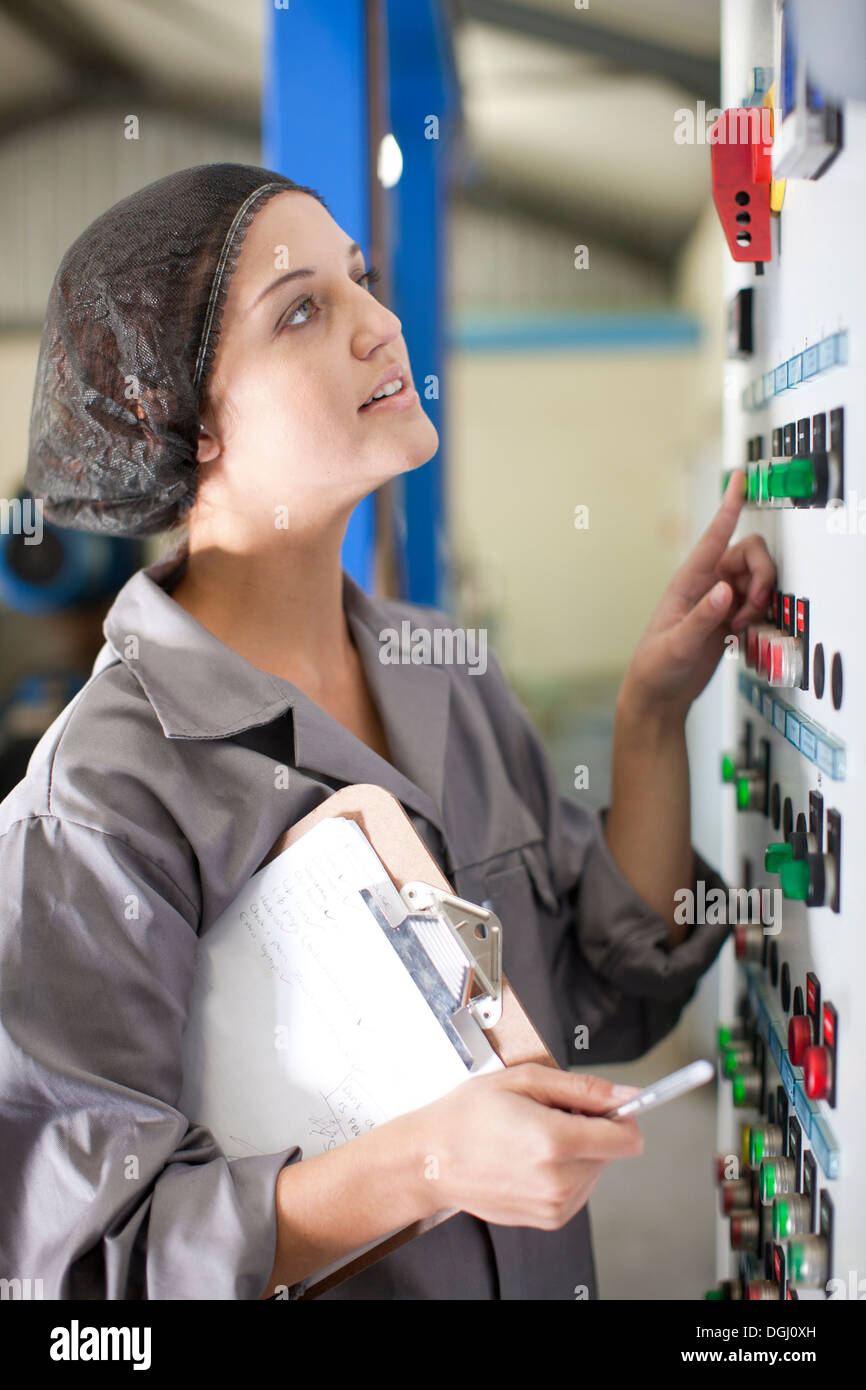 Woman at control panel in olive processing plant Stock Photo - Alamy