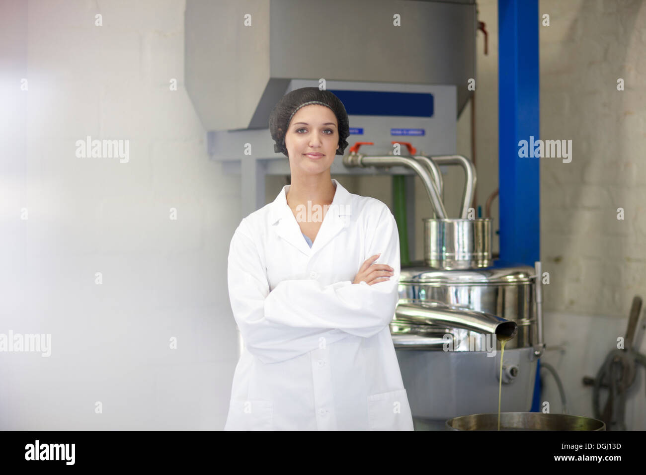 Portrait of woman in olive processing plant Stock Photo - Alamy