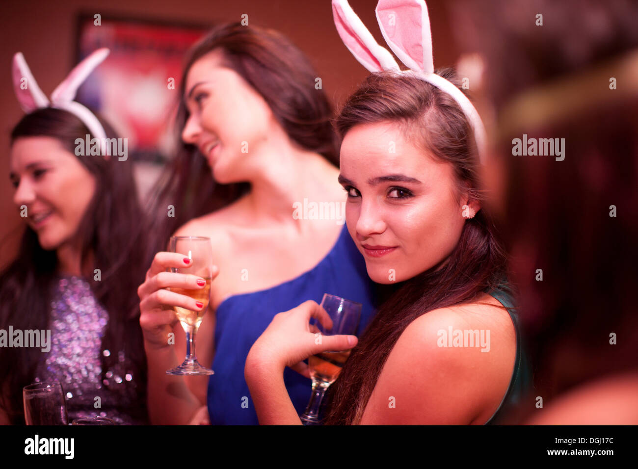 Young women wearing bunny ears at hen party Stock Photo - Alamy