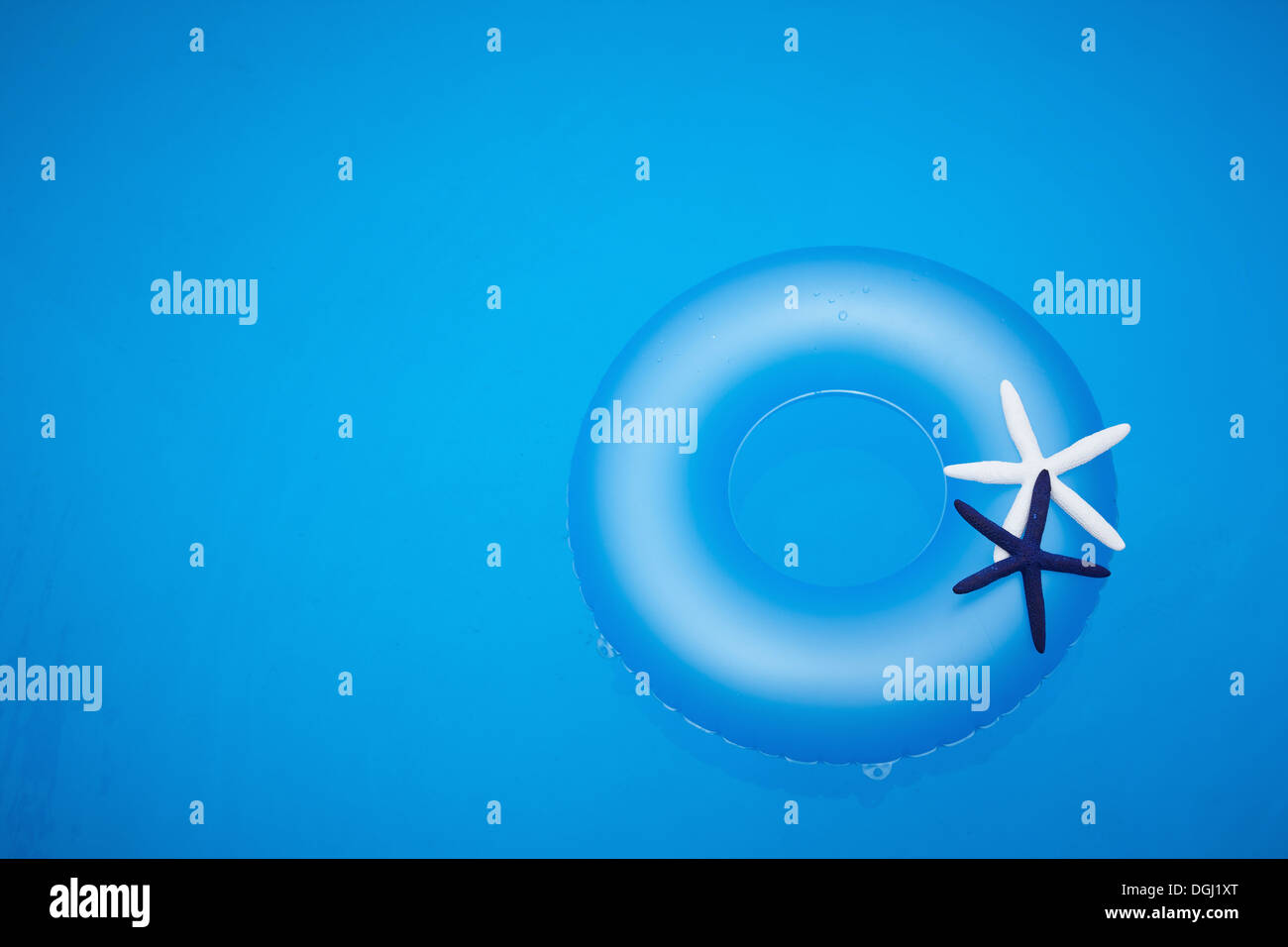 a blue swimming tube in the water Stock Photo - Alamy