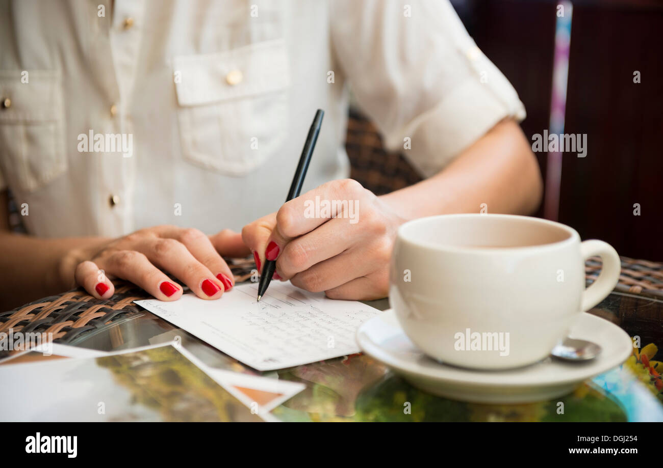Woman writing hi-res stock photography and images - Alamy