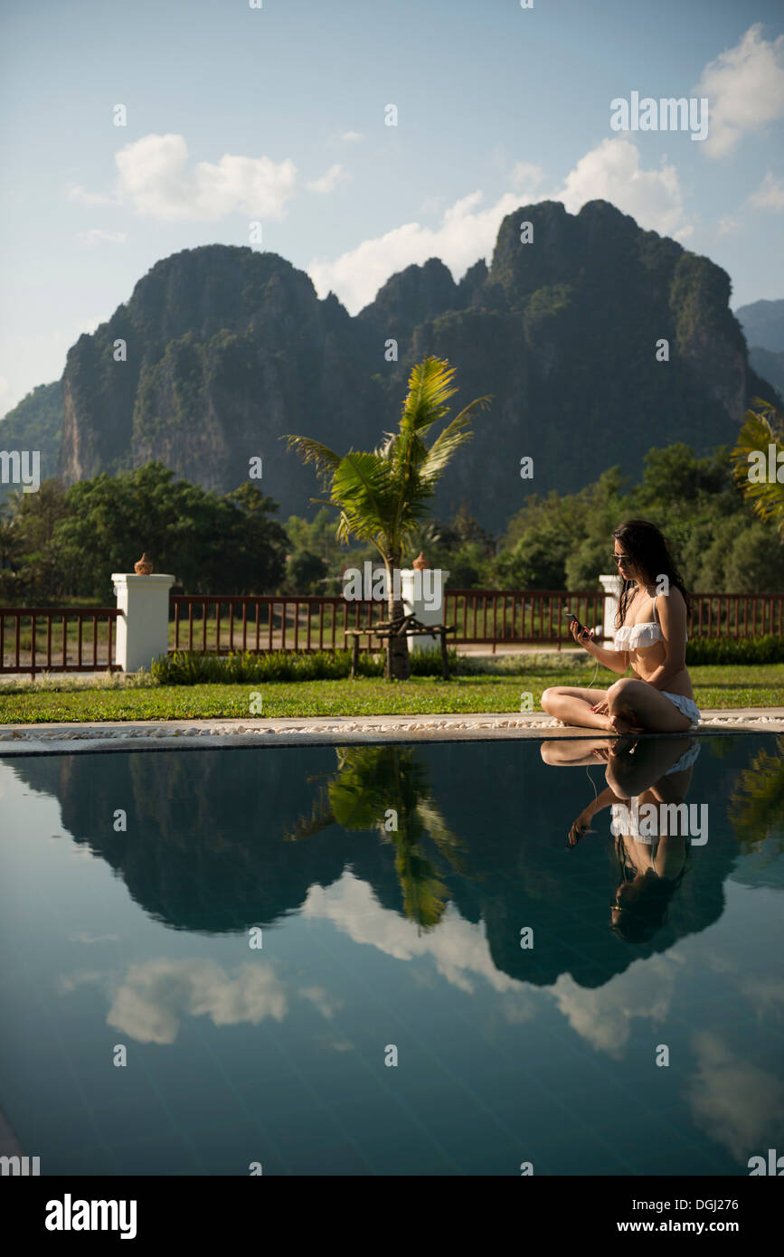 Sitting by poolside hi-res stock photography and images - Alamy