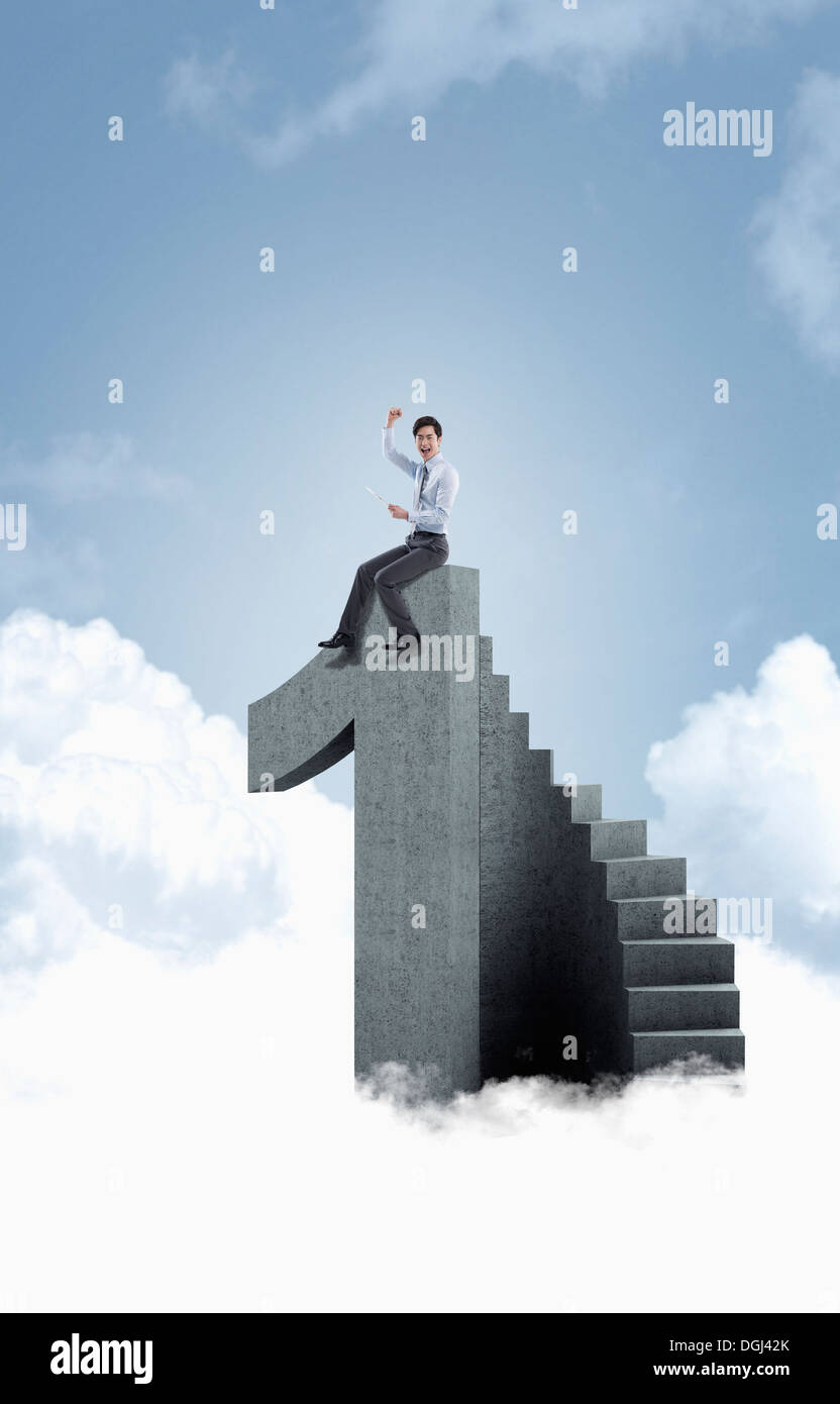 a business man standing on top of the number one Stock Photo - Alamy