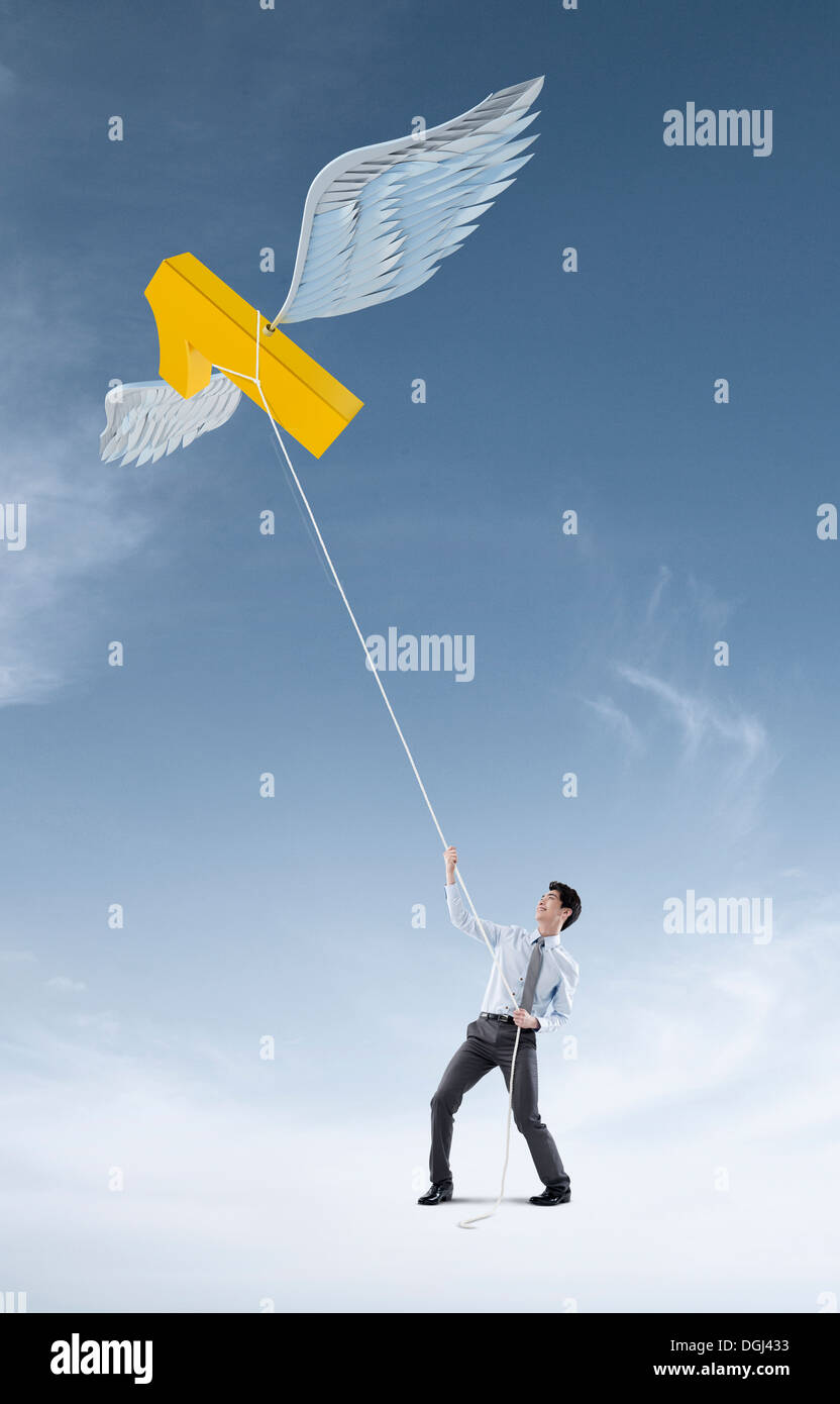 a business man catching a flying number one Stock Photo - Alamy