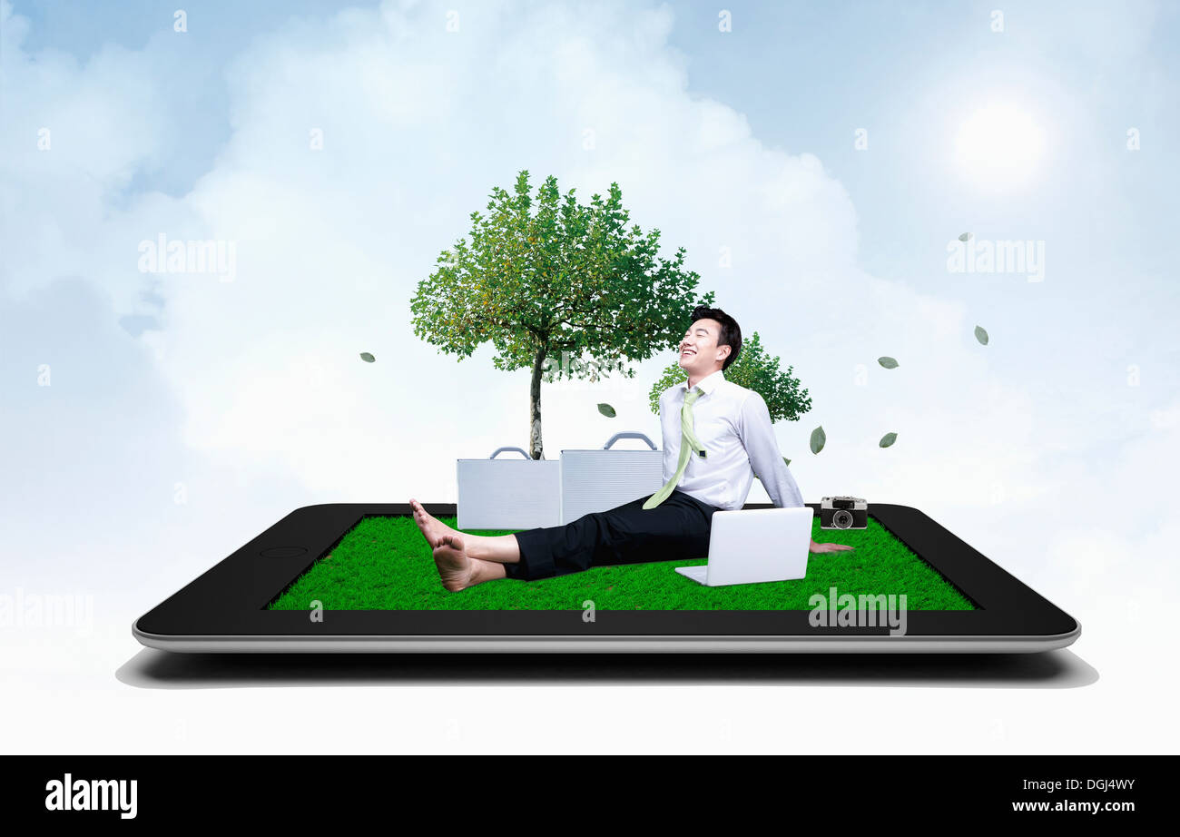 Businessman laptop working under tree hi-res stock photography and ...