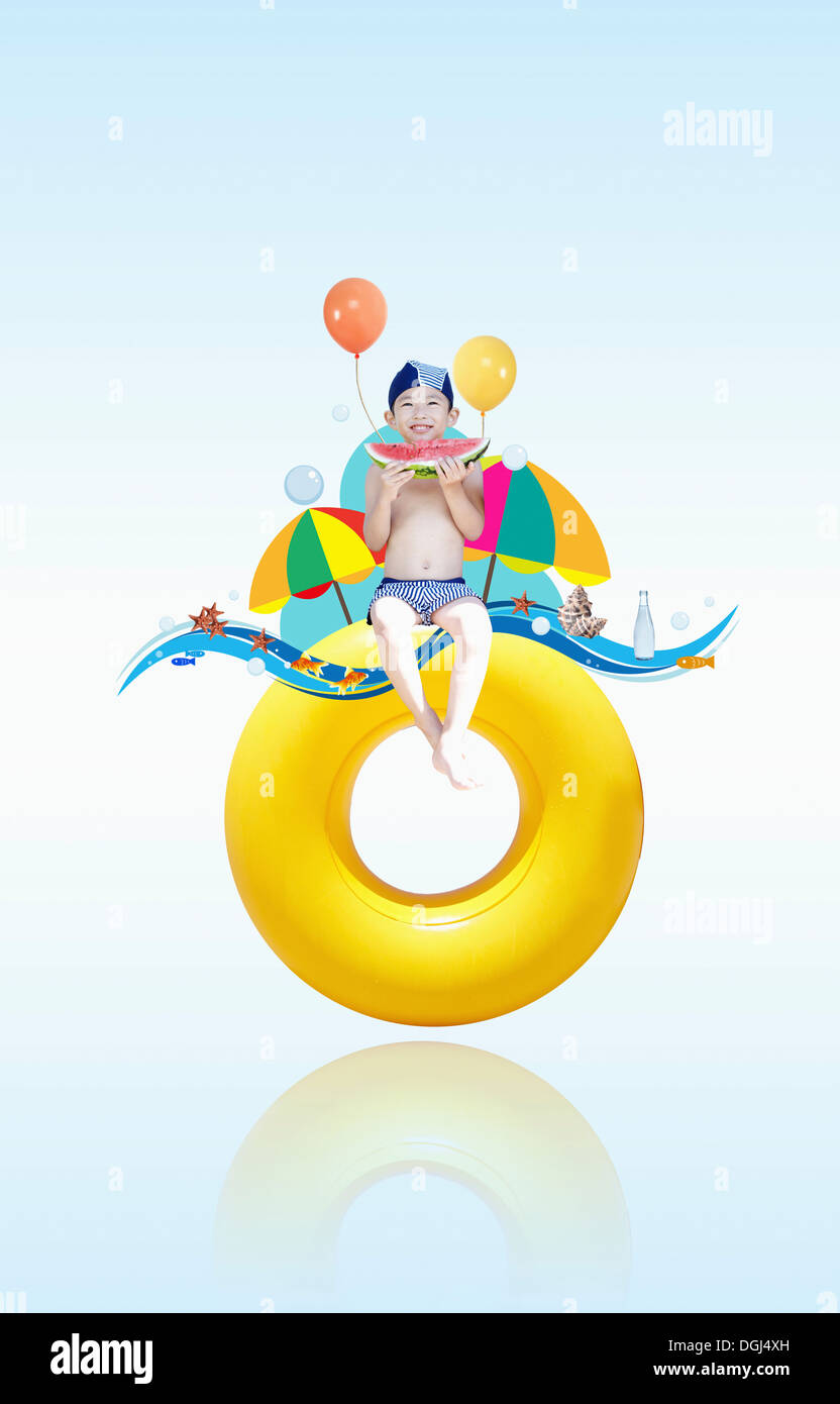 a boy sitting on a yellow swimming tube Stock Photo - Alamy