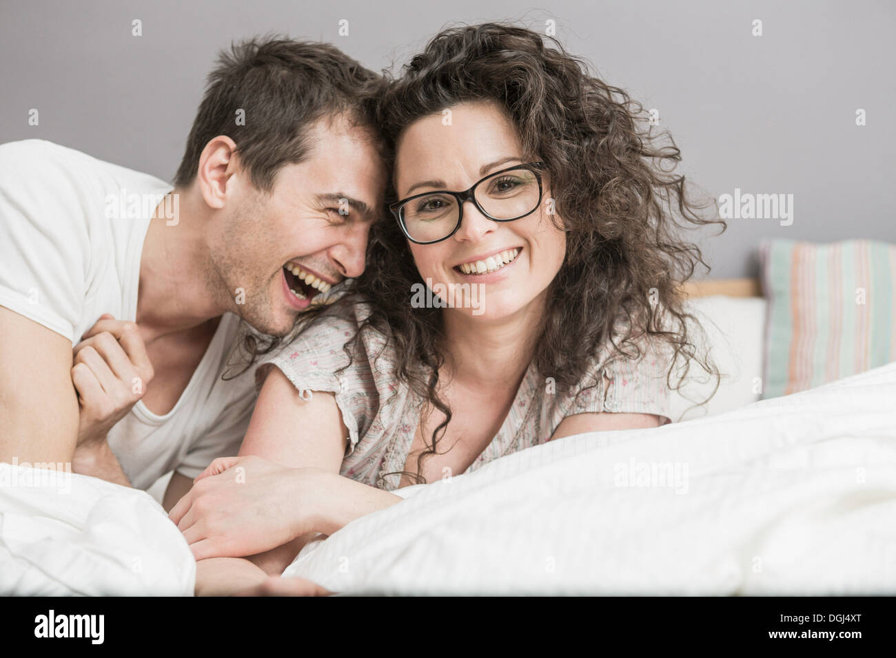 Laughing couple bed hi-res stock photography and images - Alamy