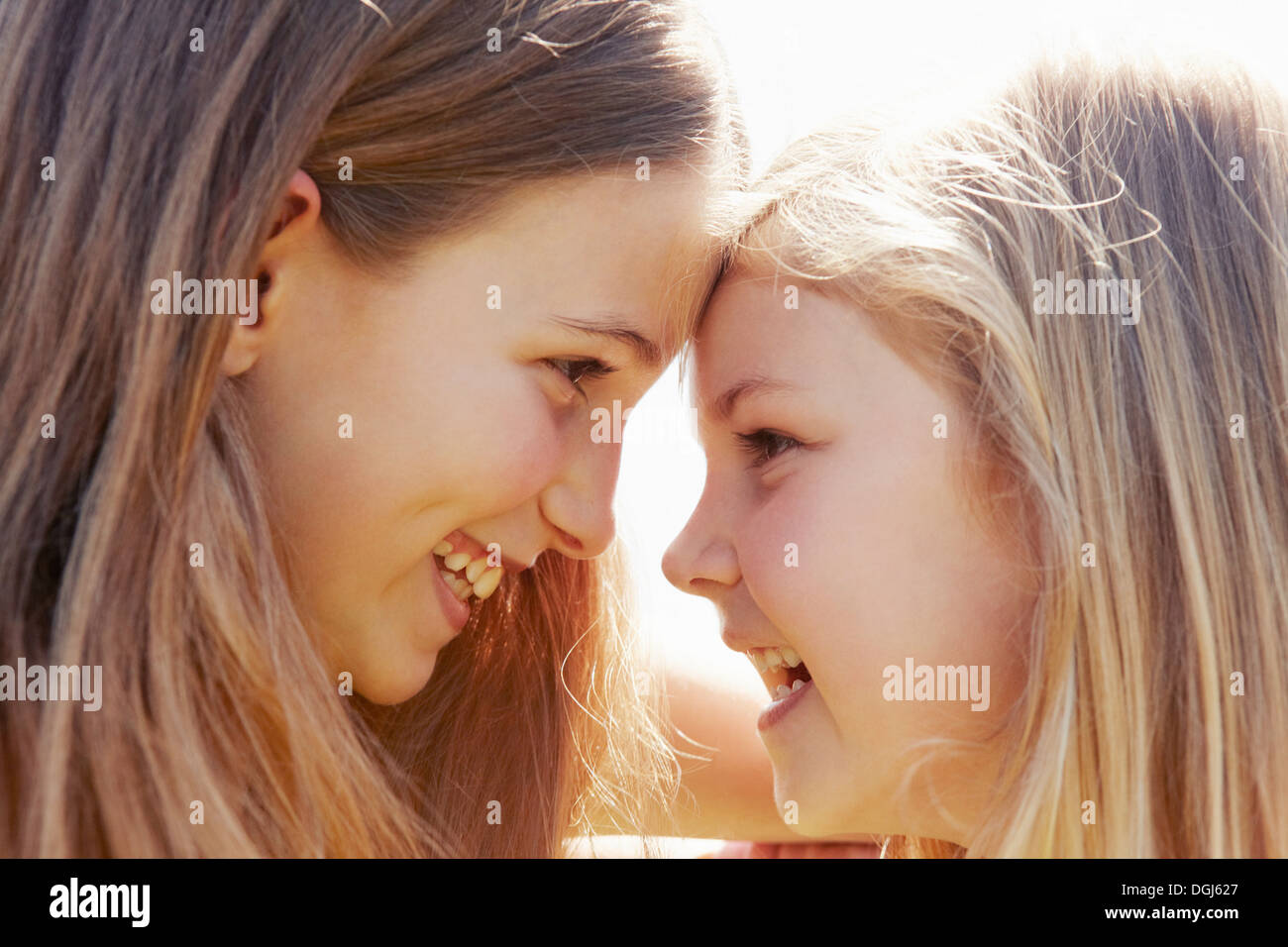 Children touching foreheads Stock Photo - Alamy