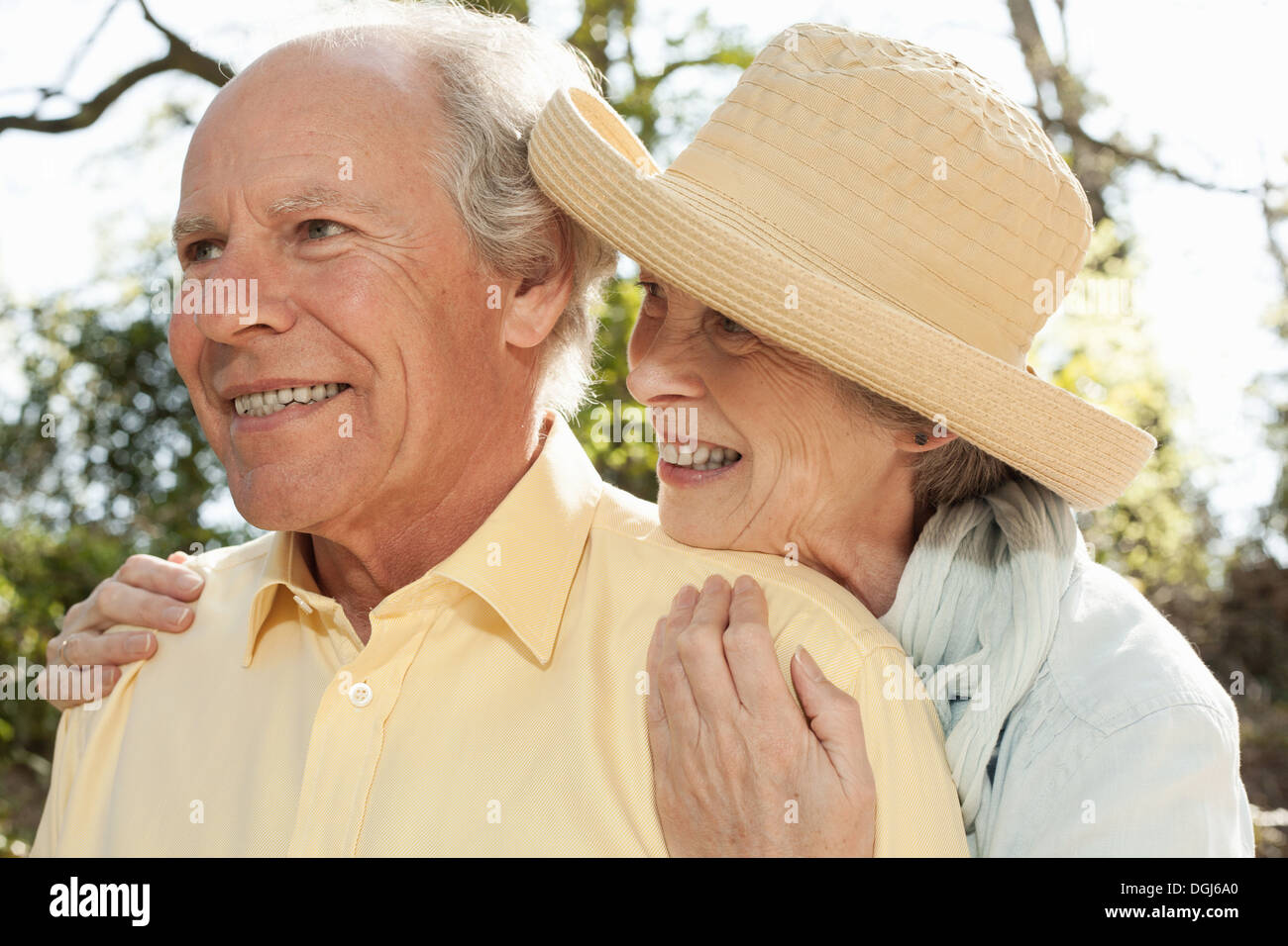 Wife hugging husband from behind Stock Photo - Alamy