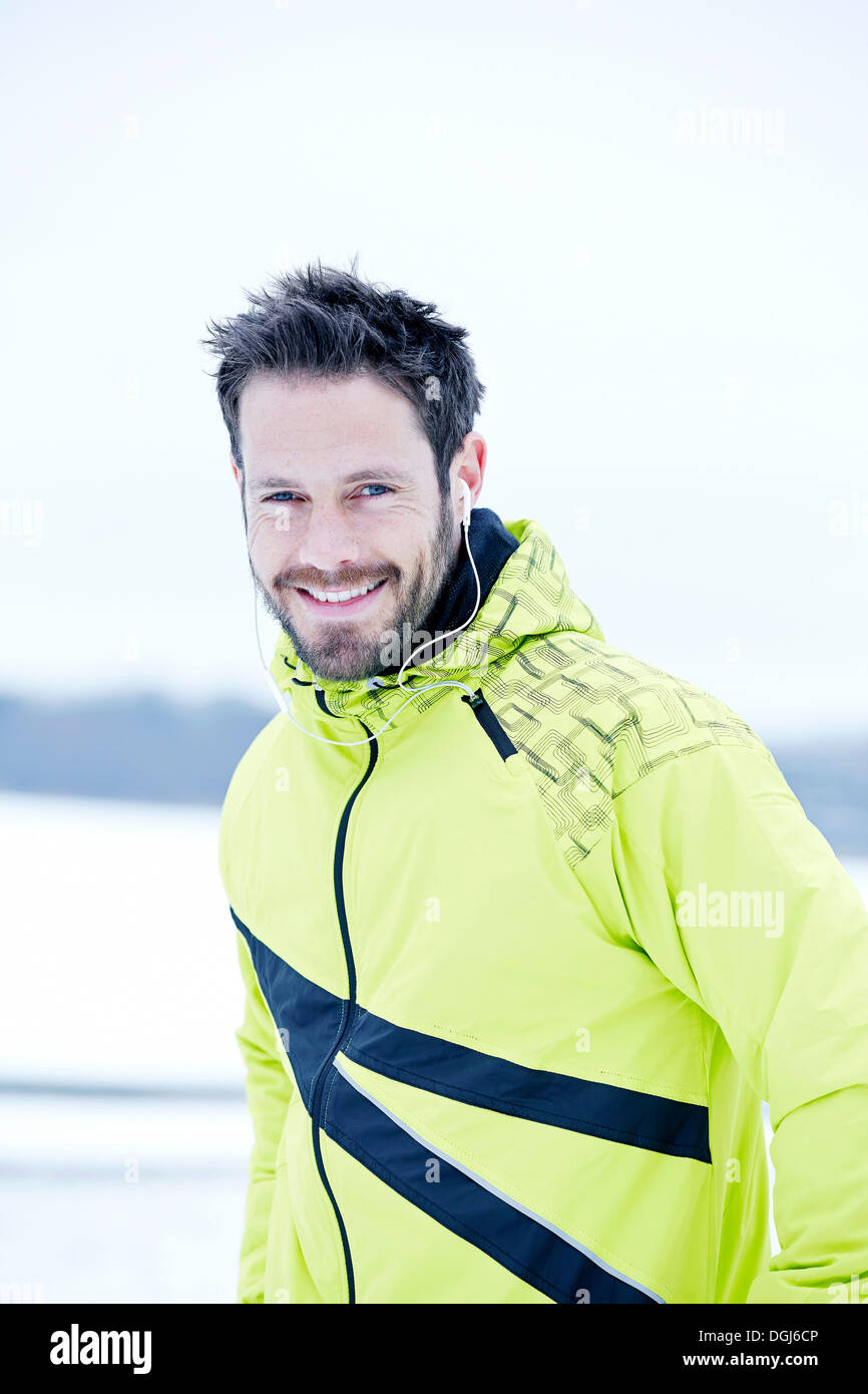Man in yellow tracksuit smiling hi-res stock photography and images - Alamy
