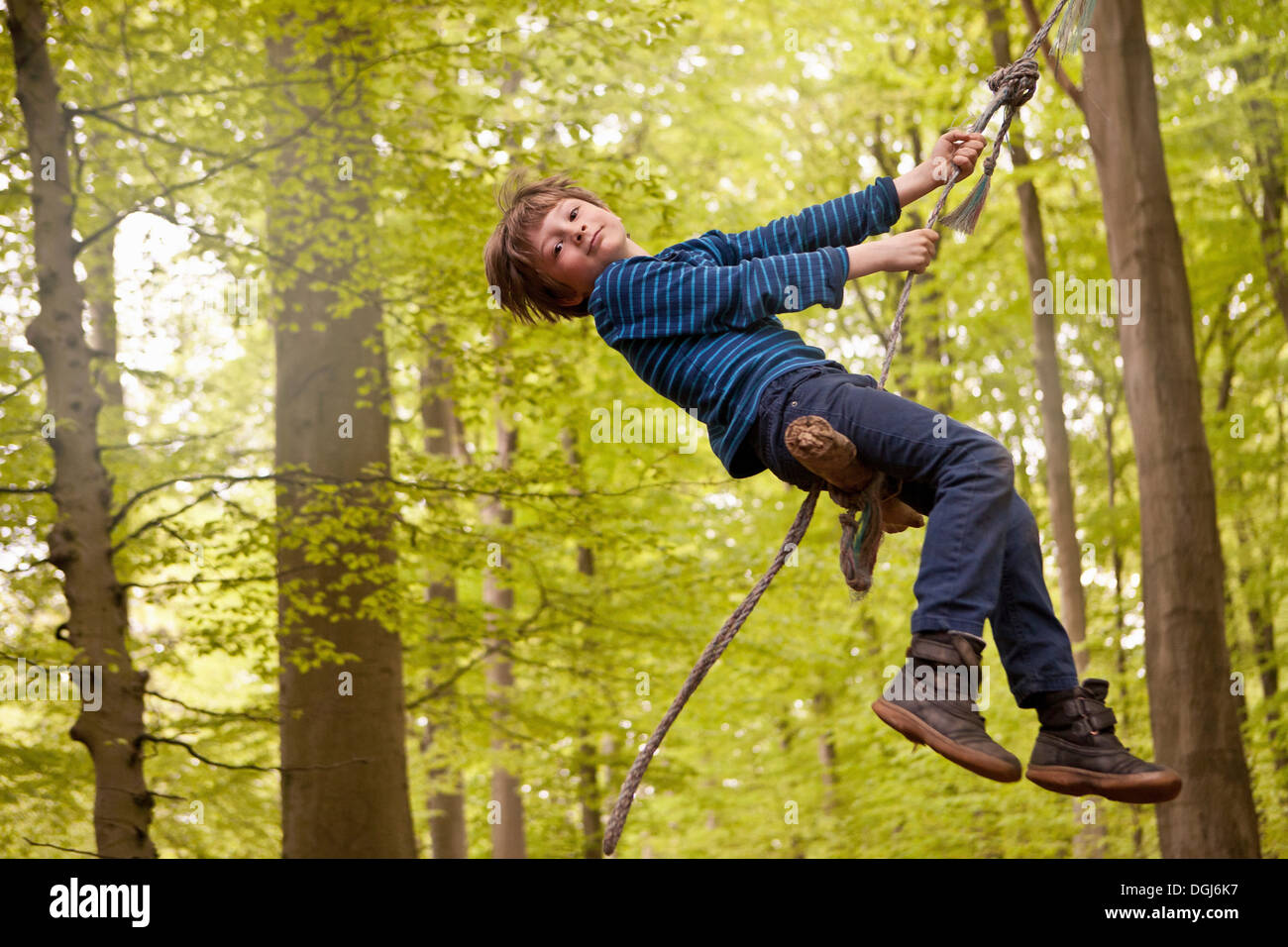 Child swinging on rope hi-res stock photography and images - Alamy