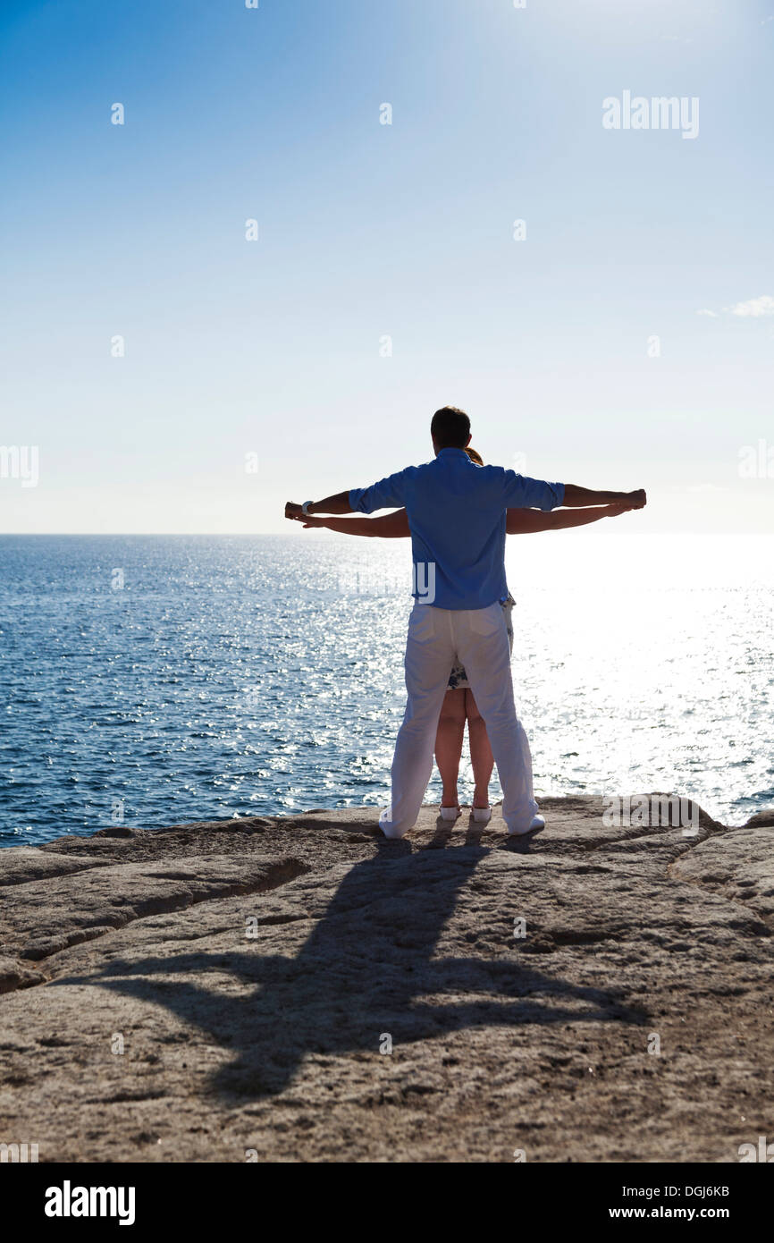 Young couple arms outstreched hi-res stock photography and images - Alamy