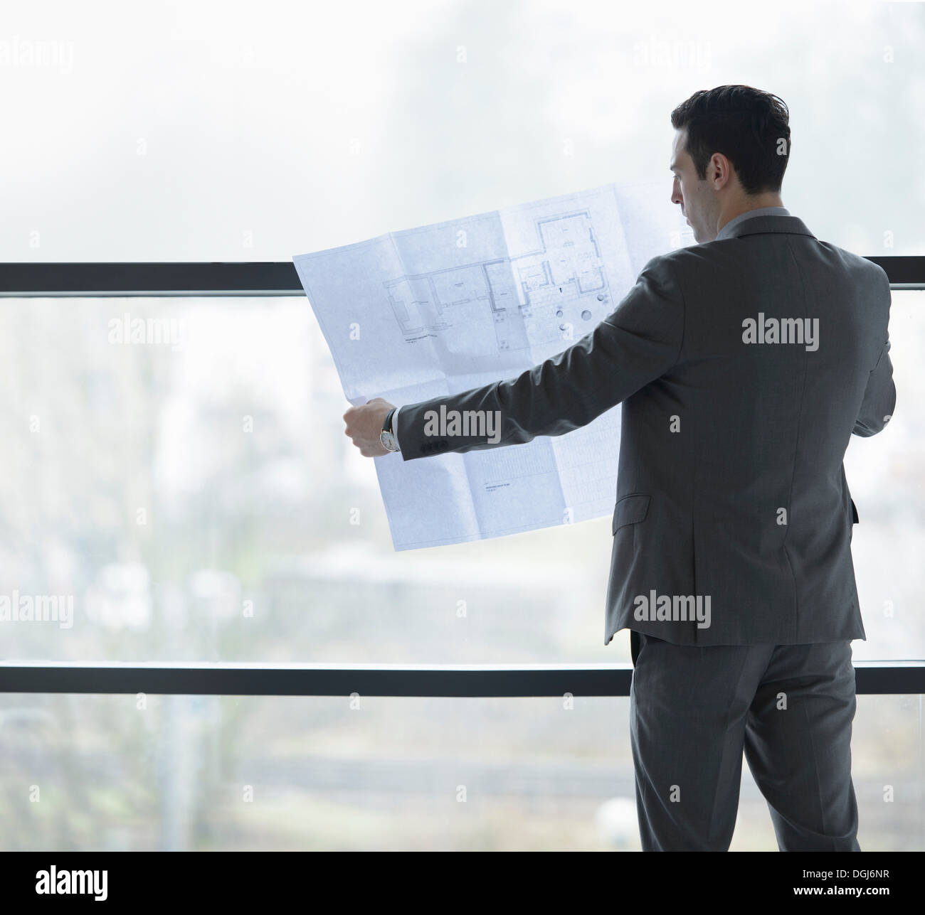 Man office window standing hi-res stock photography and images - Alamy