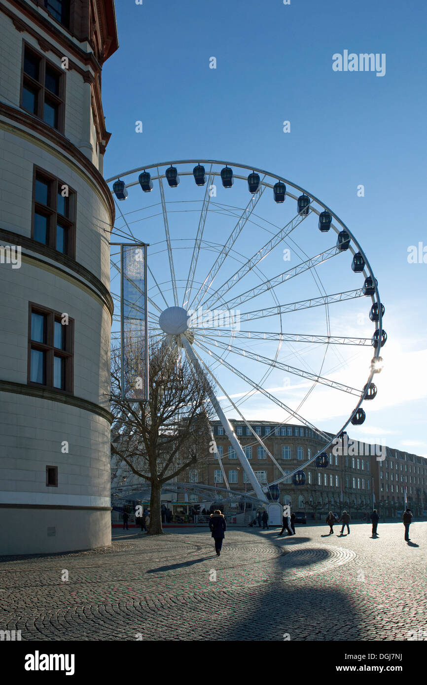 A ferris wheel behind the Shipping Museum tower in Dusseldorf Stock ...